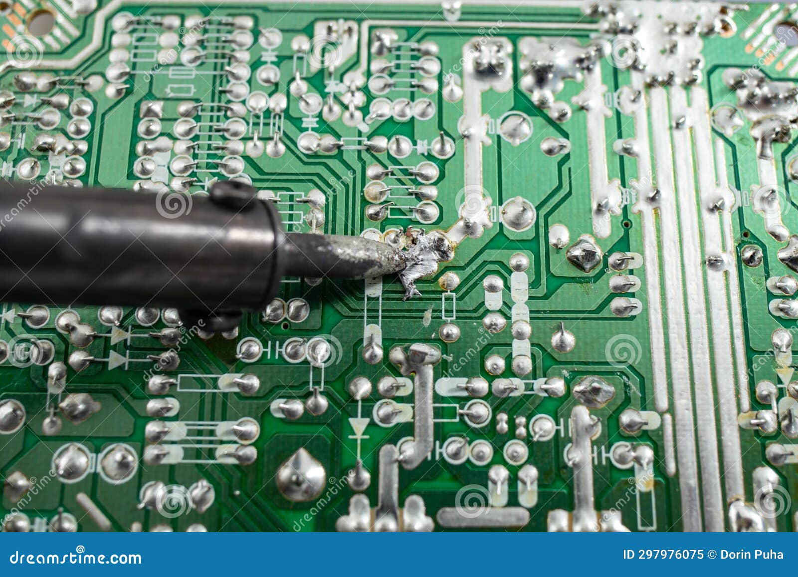 Close Up of a Soldering Iron Working on a Motherboard Circuit, Soft ...