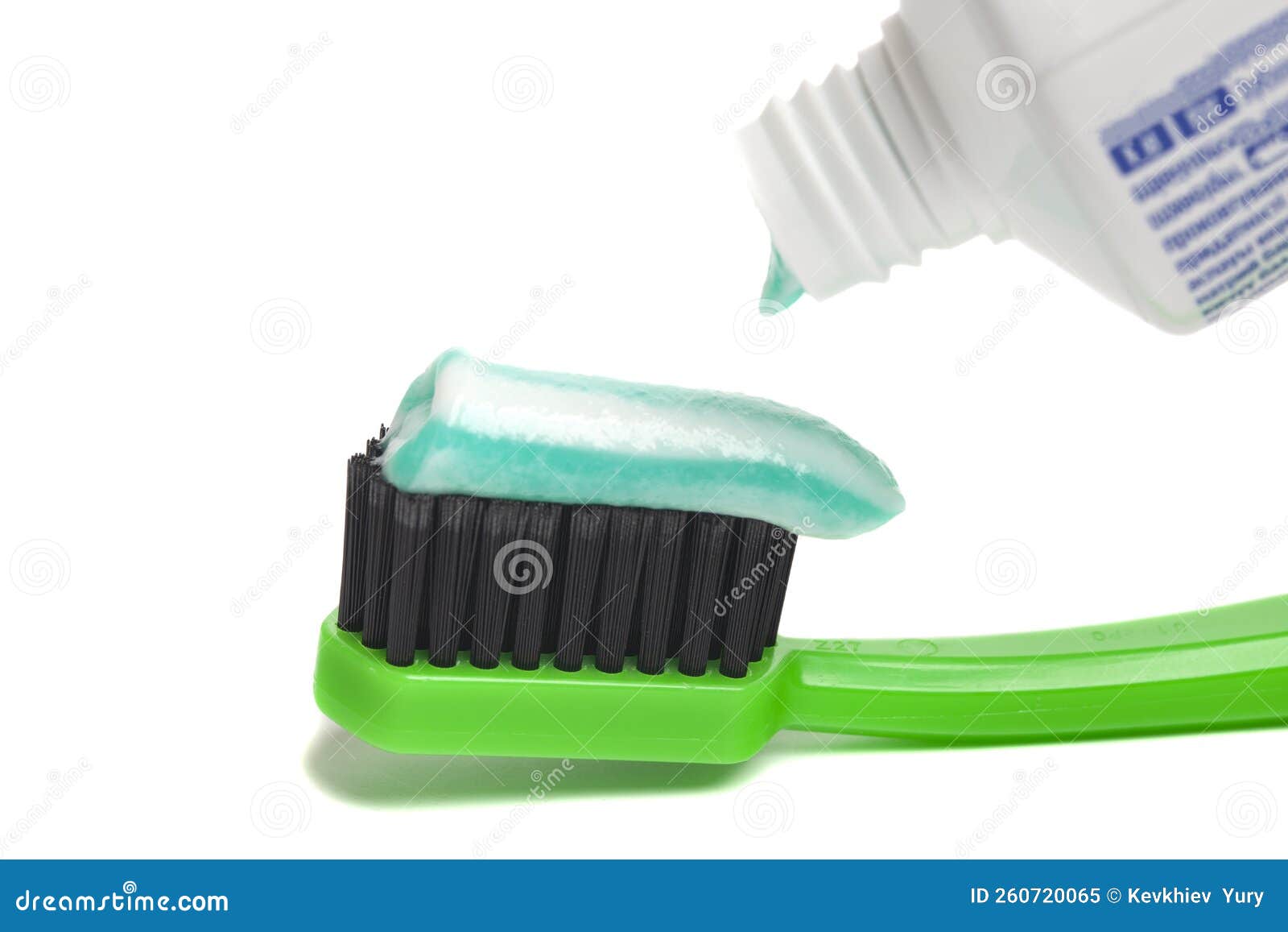 Close Up of Squeezing Toothpaste on Toothbrush on White Background ...