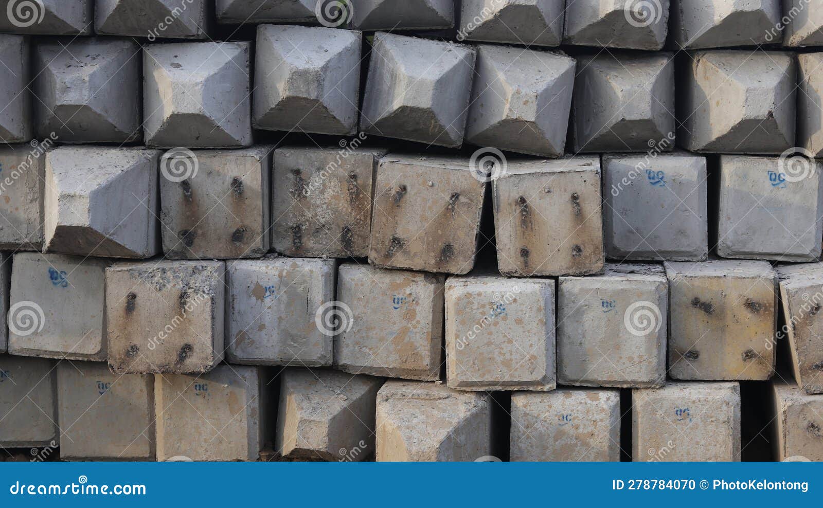 Close-up of a Stack of Prestressed Concrete Piles on the Ground for ...
