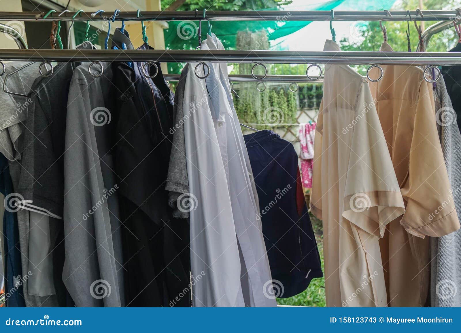 Close Up Steel Rails Full with Wet Clothes for Drying after Washing ...