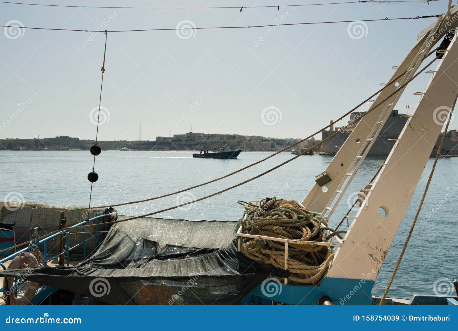 Valletta, Malta, August 2019. Feed the Fishing Trawler at the Pier and ...