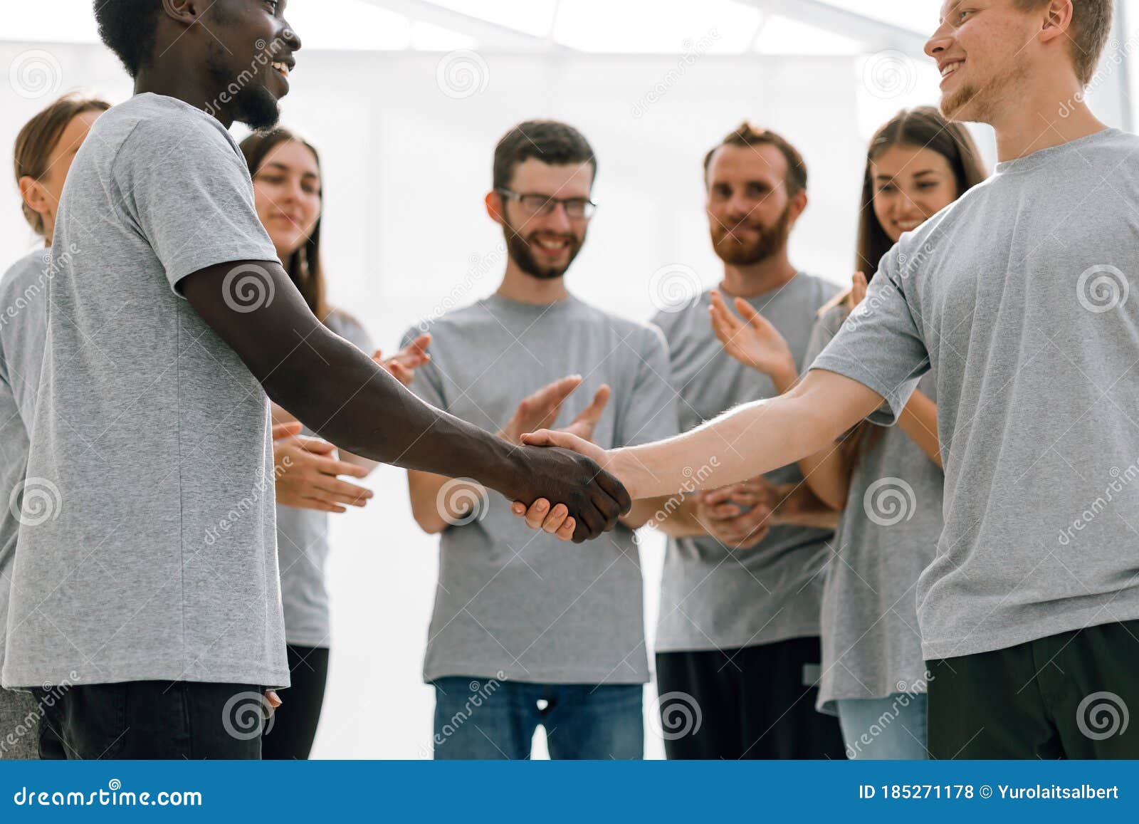 Close Up. Strong Handshake of Two Students of Different Nationalities ...