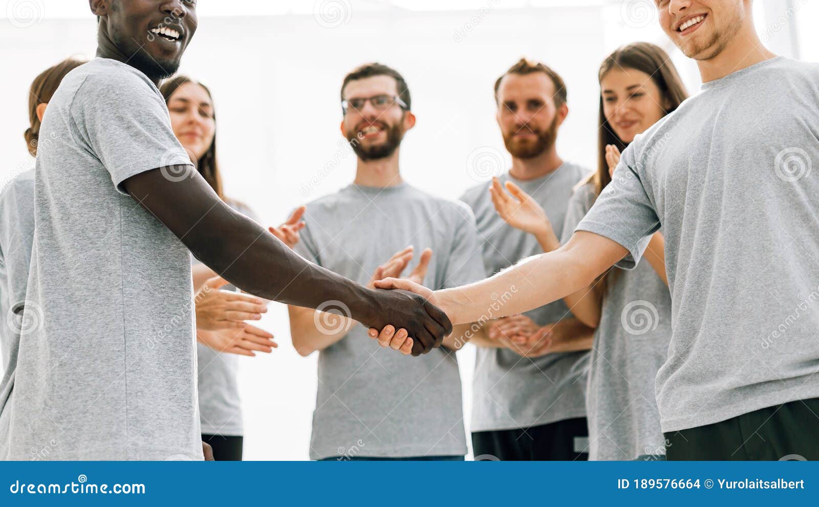 Close Up. Strong Handshake of Two Students of Different Nationalities ...