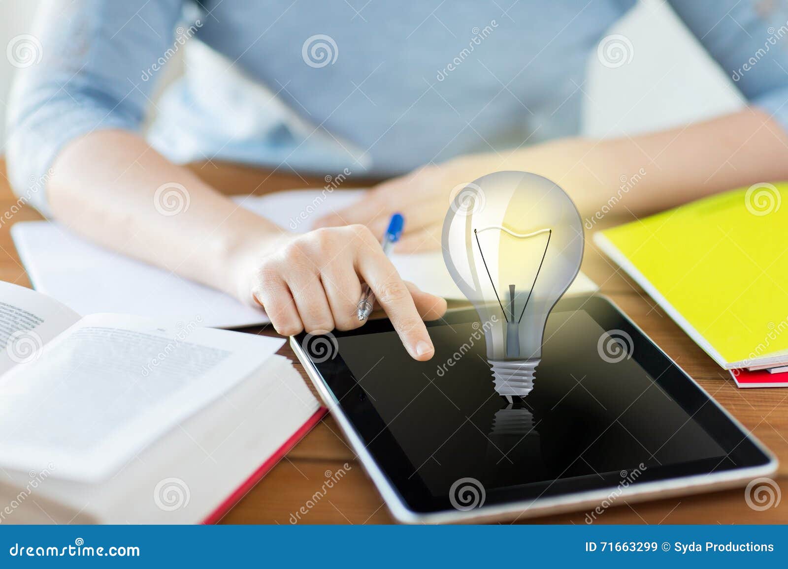 Close Up of Student with Light Bulb on Tablet Pc Stock Image - Image of ...