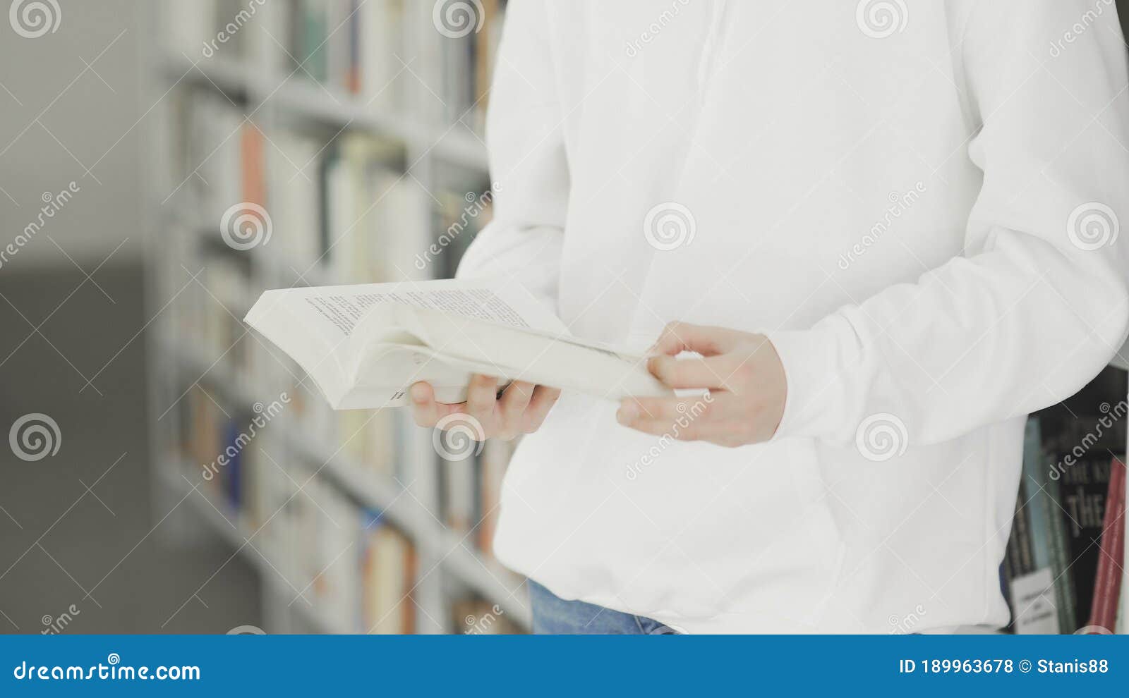 Close Up of Student Man is Reading Book in Library Stock Photo - Image ...