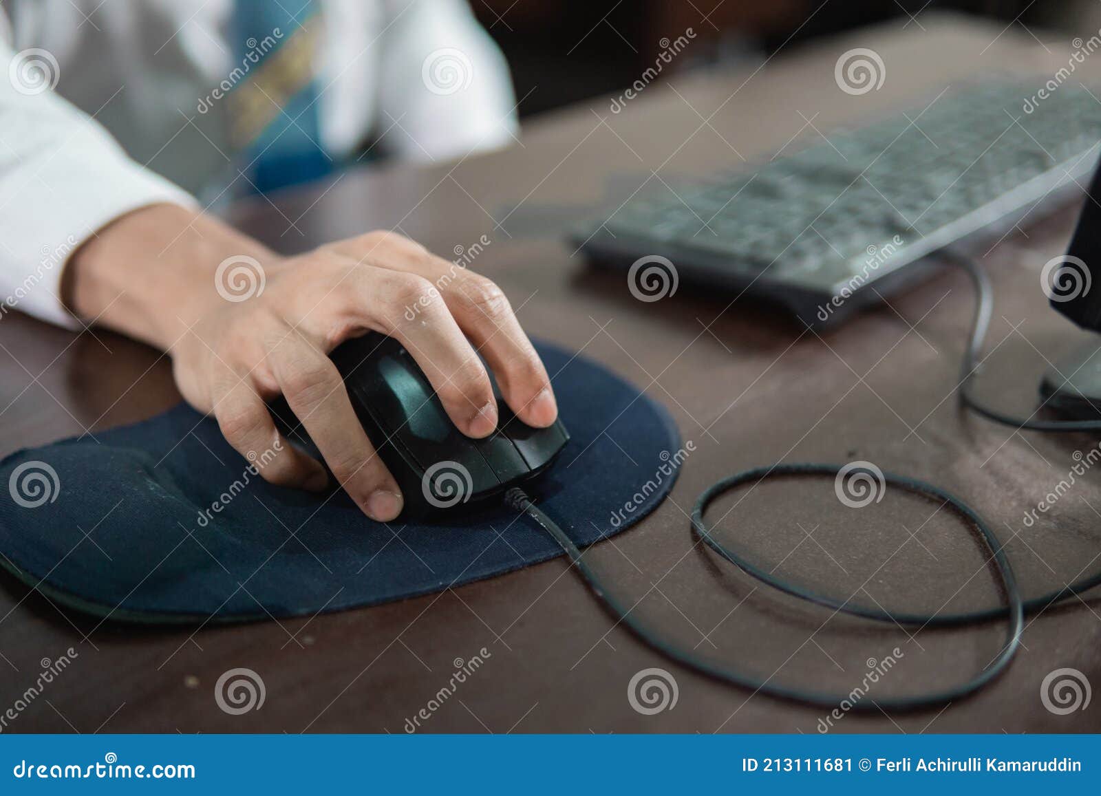 Close Up of Student& X27;s Hand Holding the Mouse Next To the Keyboard ...