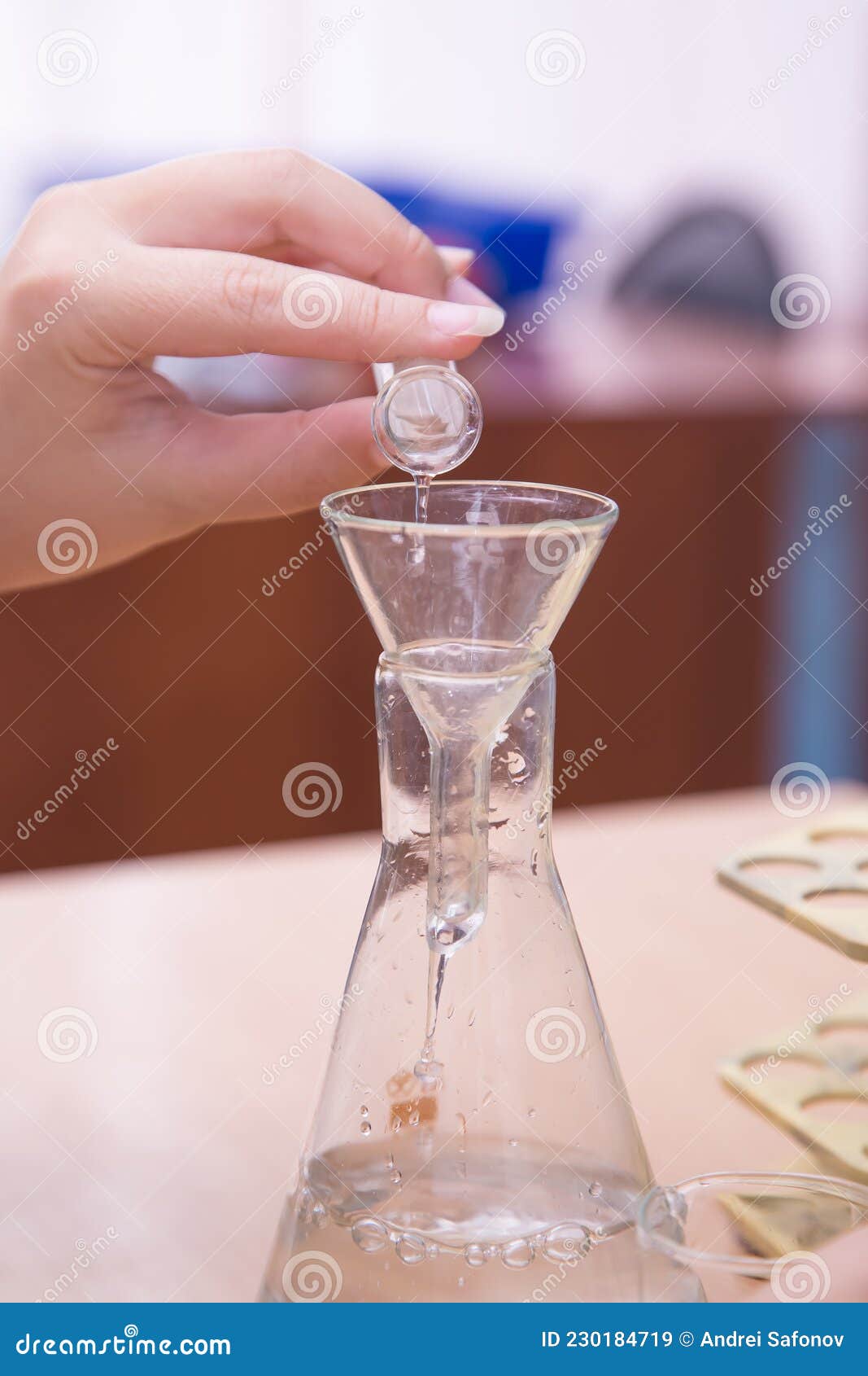 Close-up of a Student& X27;s Hand Pouring a Chemical Solution into a ...