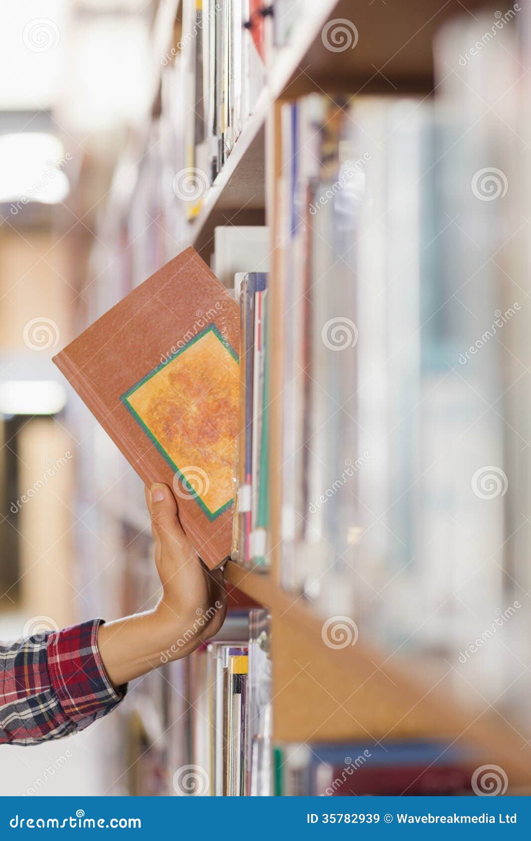 Close Up of Student Taking Book Out of Shelf Stock Image - Image of ...