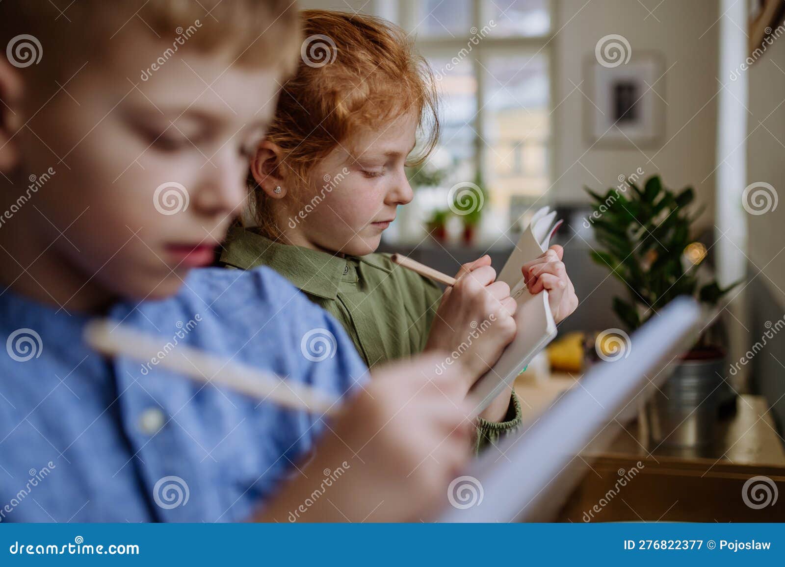 Close Up of Students Writing Notes in To Their Notepads. Stock Image ...
