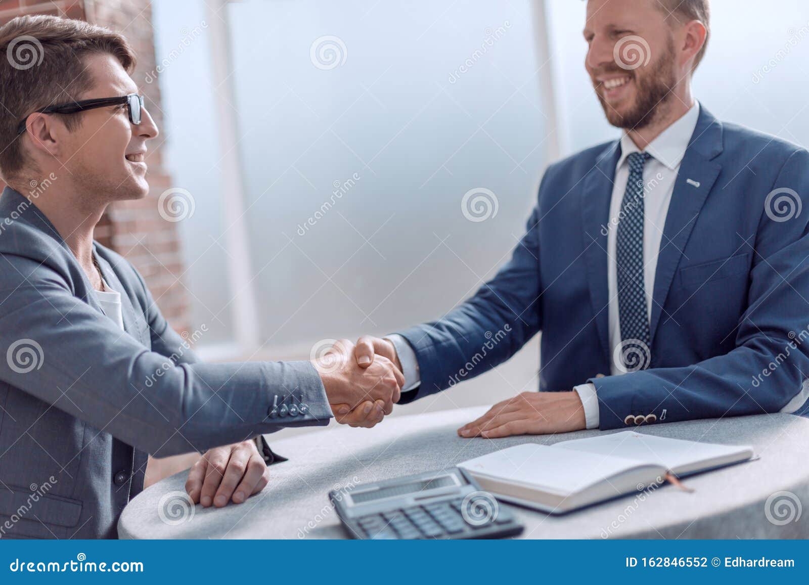 Close Up. Successful Financial Partners Shaking Hands Stock Photo ...