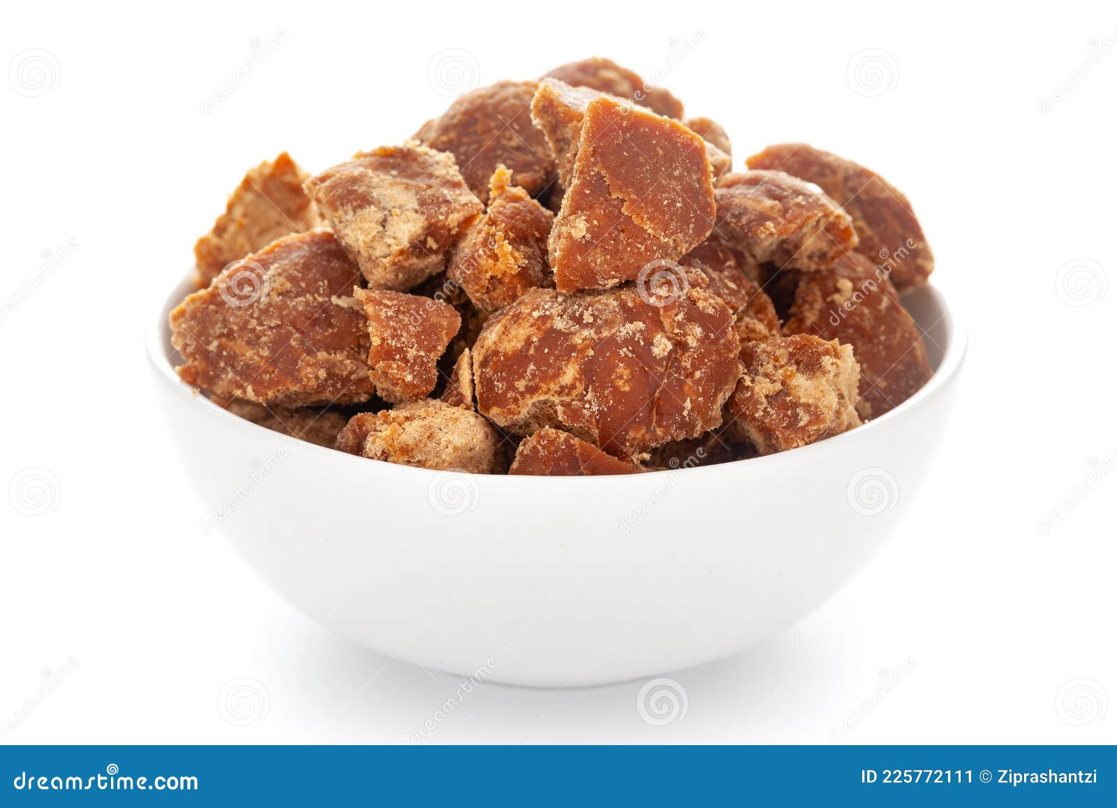 Close-Up of Sugarcane Jaggery Piece in White Ceramic Bowl Over White ...