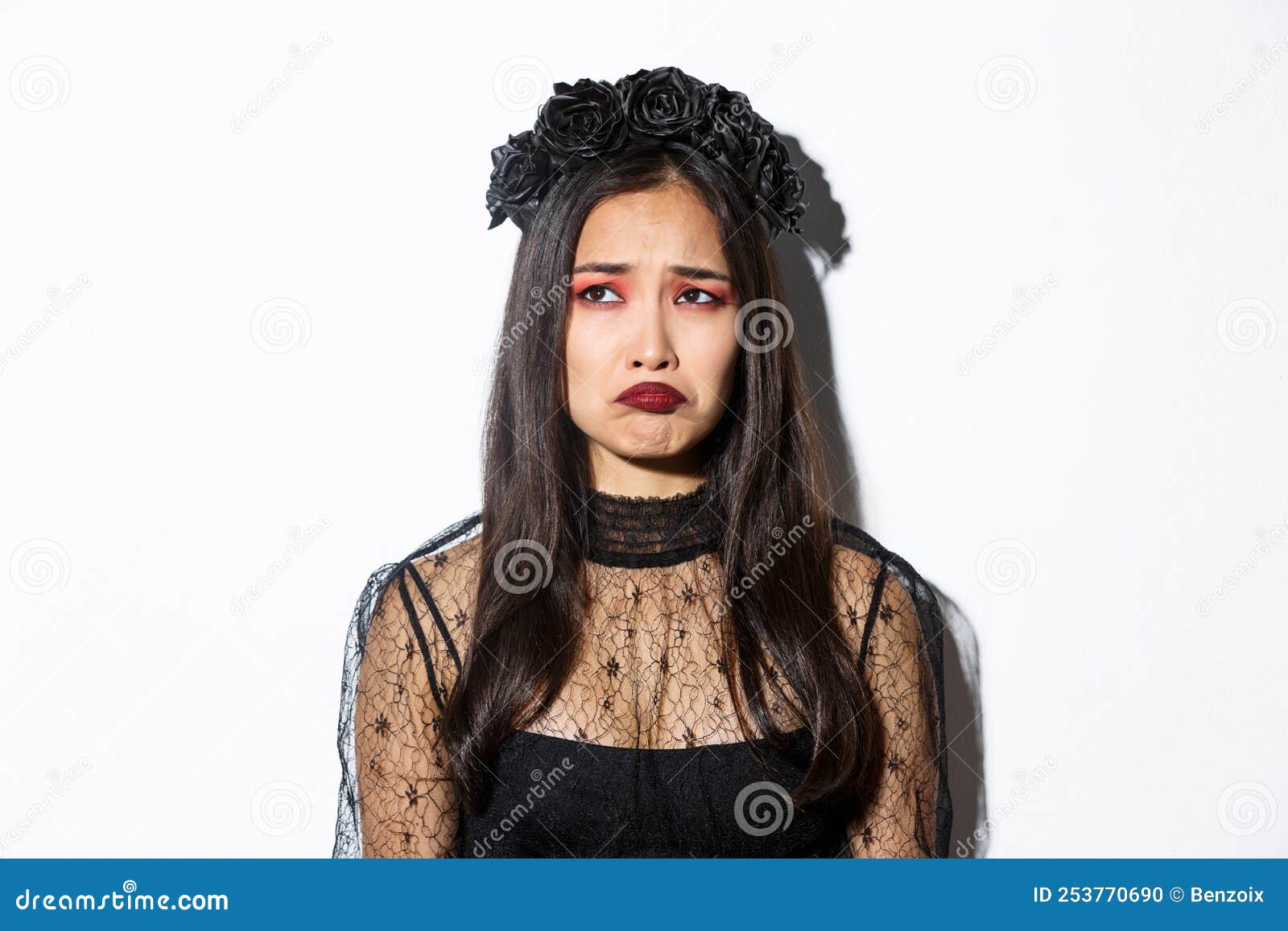 Close Up Of Sulking Sad Girl In Witch Costume Looking At Upper Left