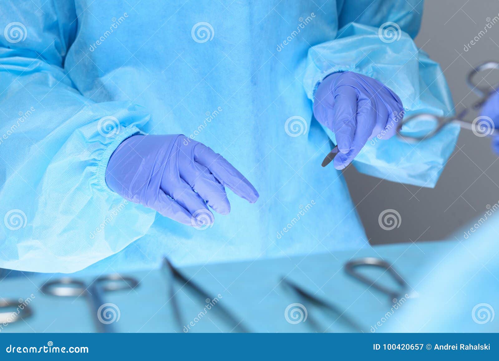 Close-up of of Surgeons Hands at Work in Operating Theater Toned in ...