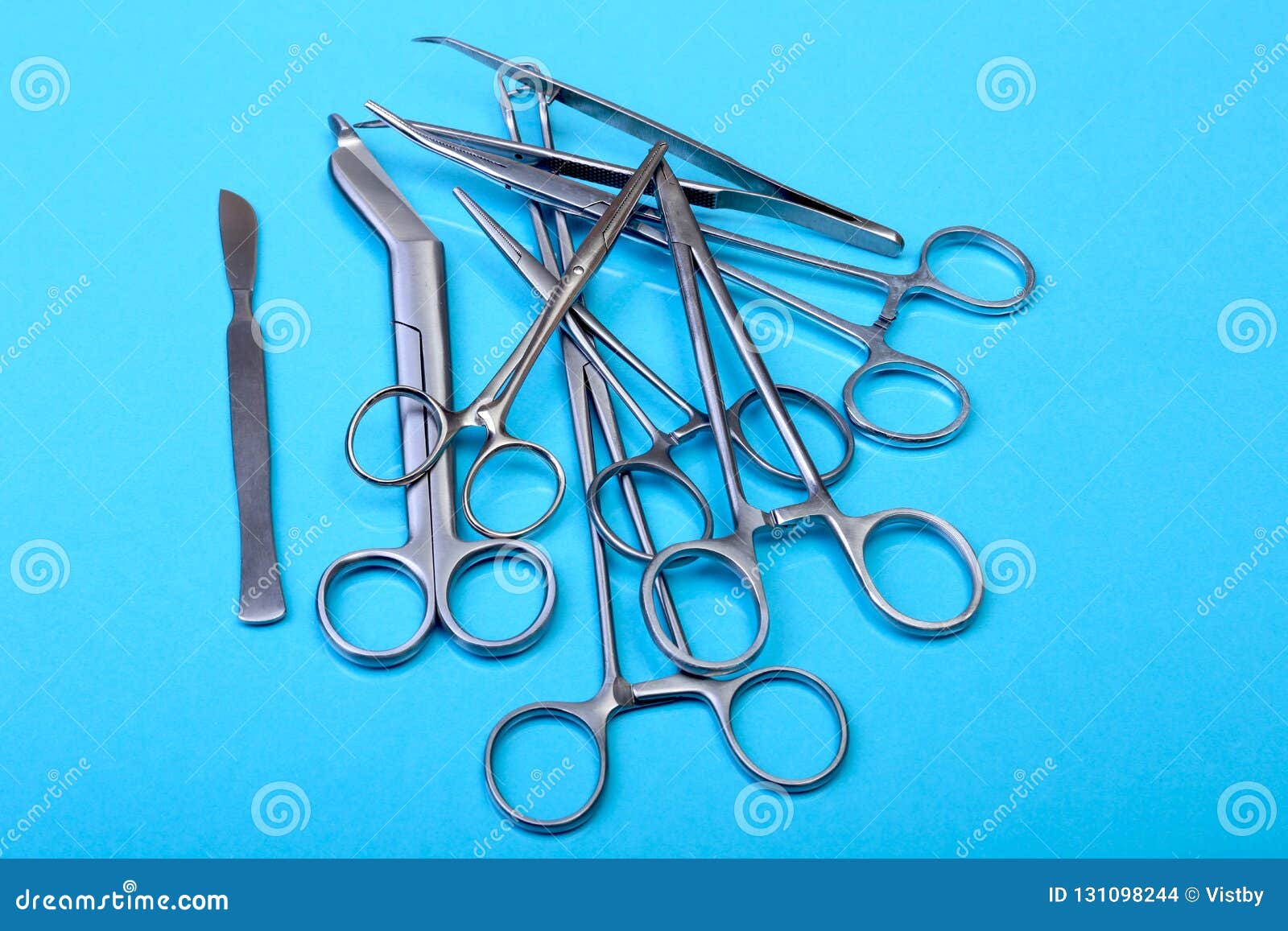 Close Up Surgical Instruments and Tools on Blue Mirror Background ...
