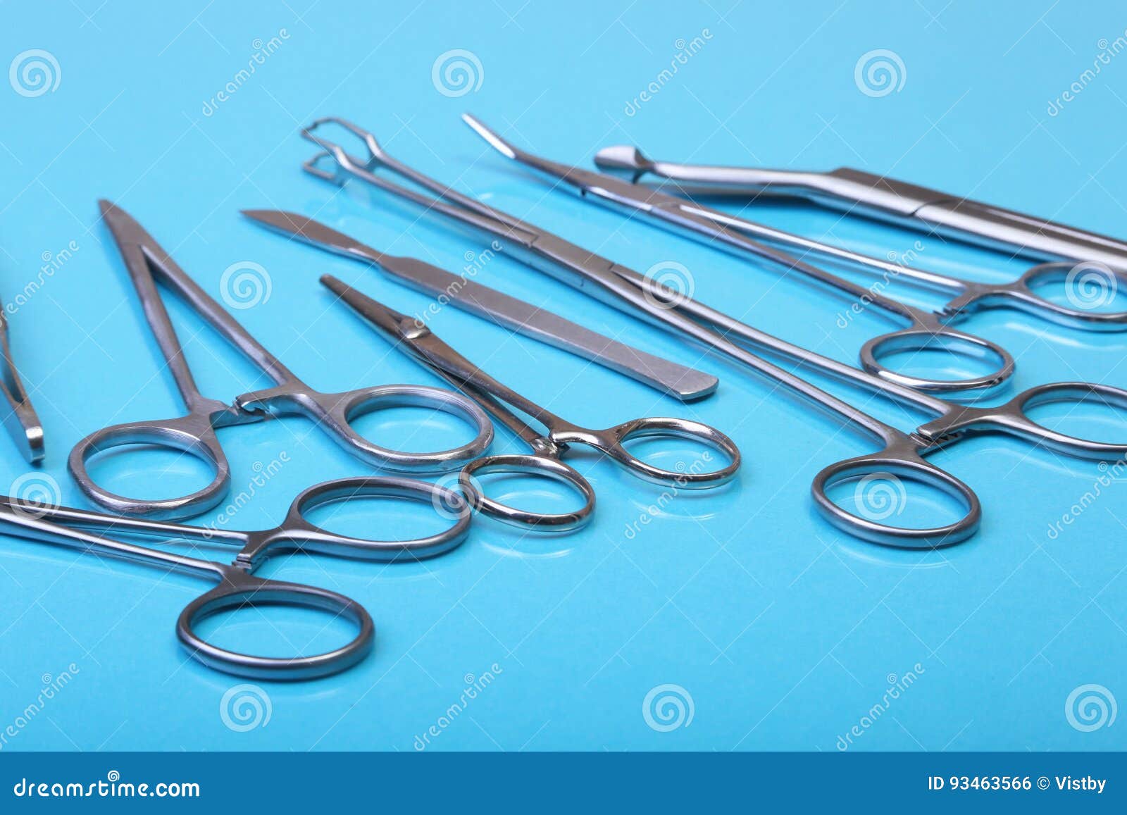 Close Up Surgical Instruments and Tools on Blue Mirror Background ...