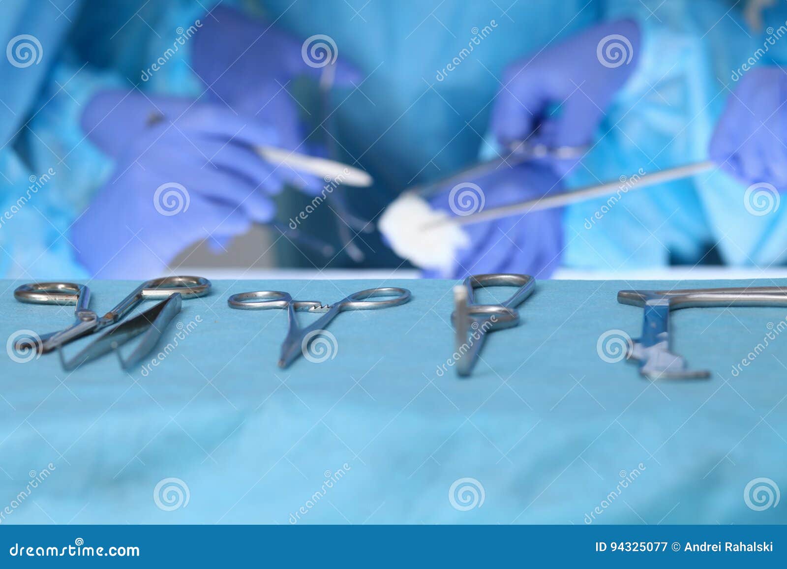 Close Up of Surgical Tools while Group of Surgeons at Work in Operating ...