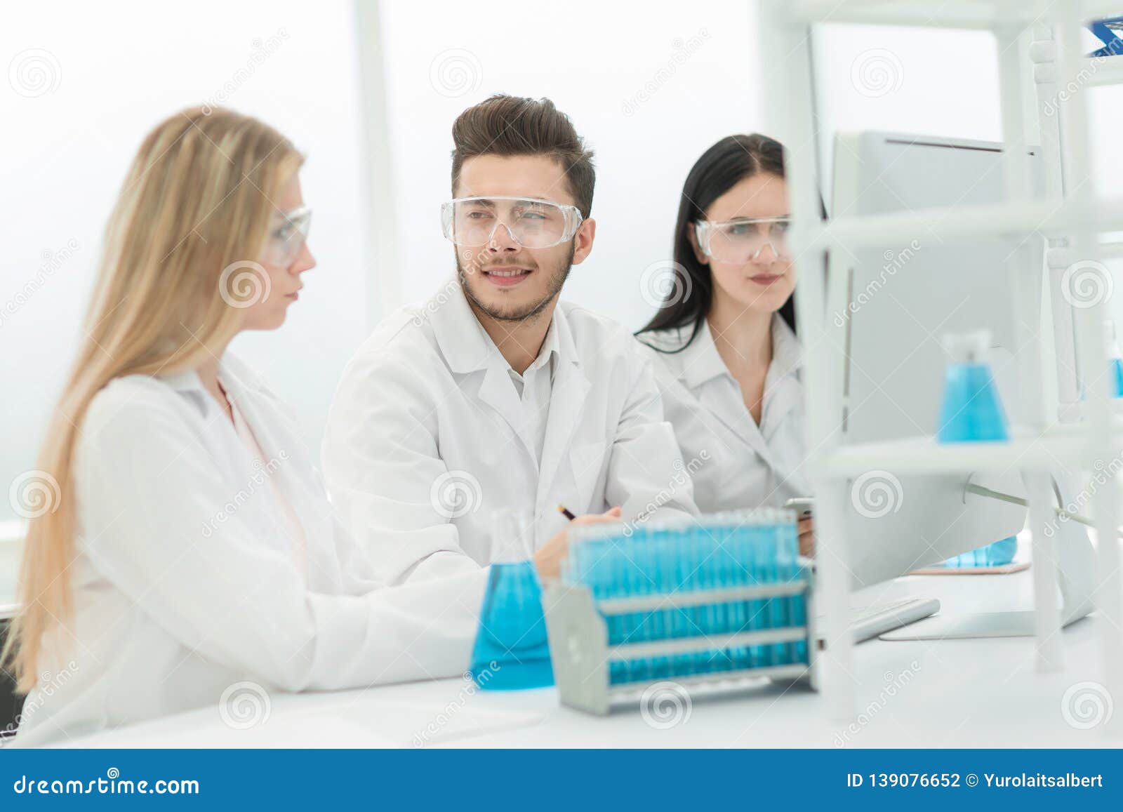 Close Up.a Team of Scientists Sitting at the Laboratory Table Stock ... Close Up.a Team of Scientists Sitting at the Laboratory Table Stock ...