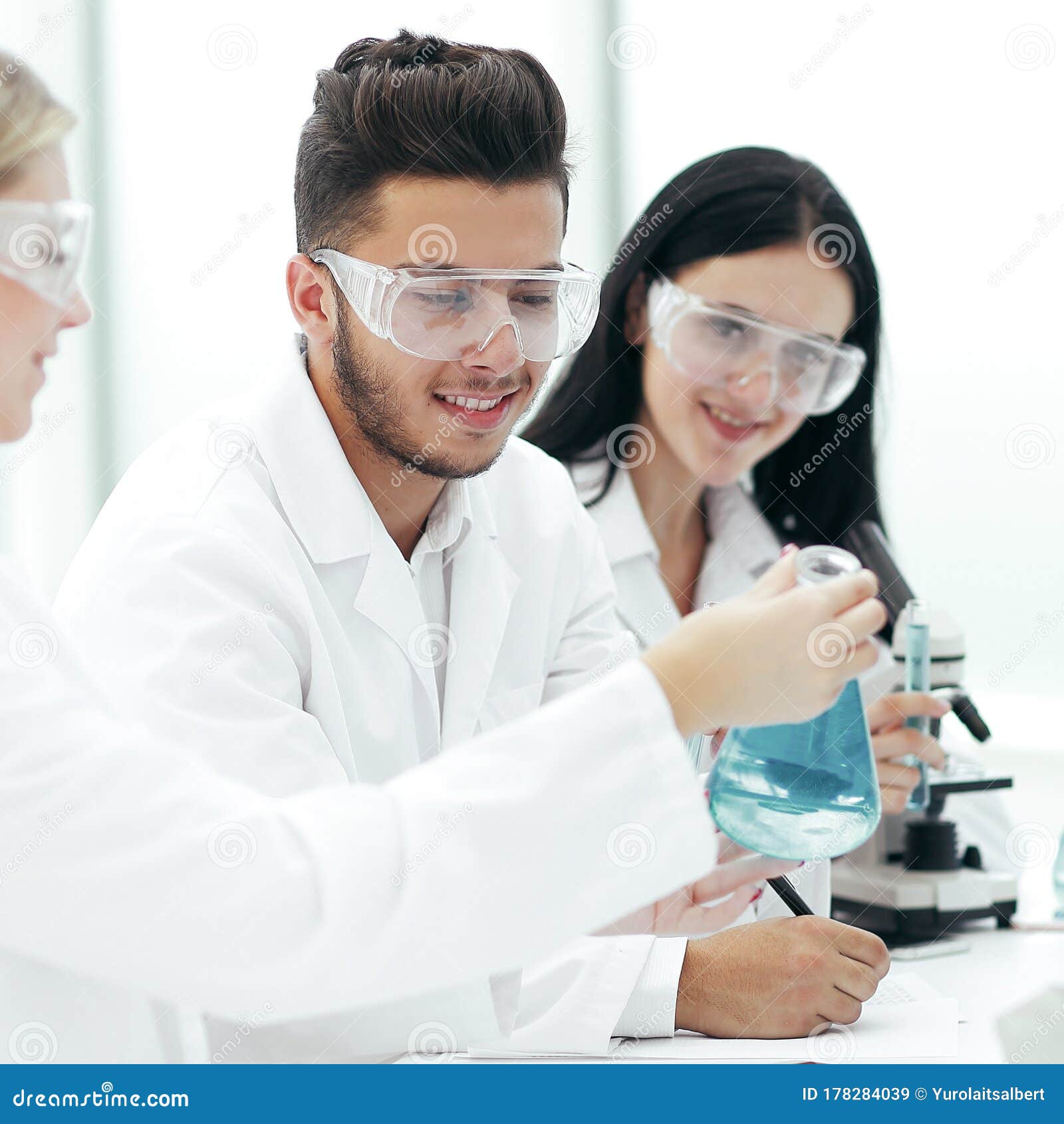 Close Up.a Team of Scientists Sitting at the Laboratory Table Stock ... Close Up.a Team of Scientists Sitting at the Laboratory Table Stock ...