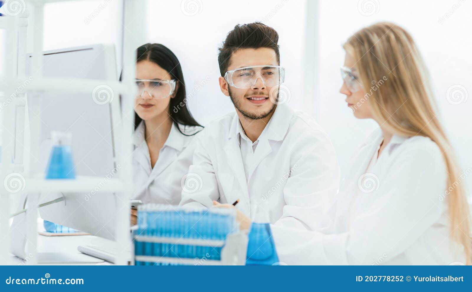 Close Up.a Team of Scientists Sitting at the Laboratory Table Stock ...