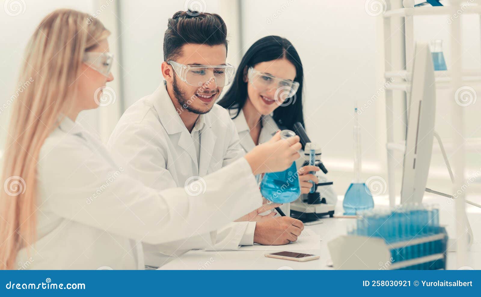 Close Up.a Team of Scientists Sitting at the Laboratory Table Stock ...