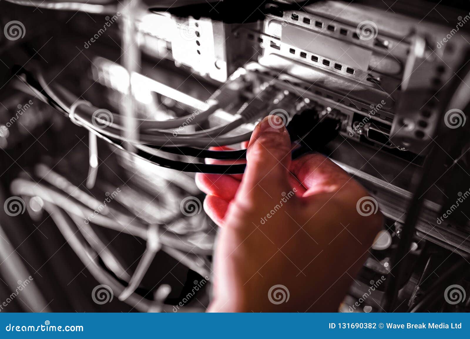 Close-Up of Technician Plugging Patch Cable in a Rack Mounted Server ...