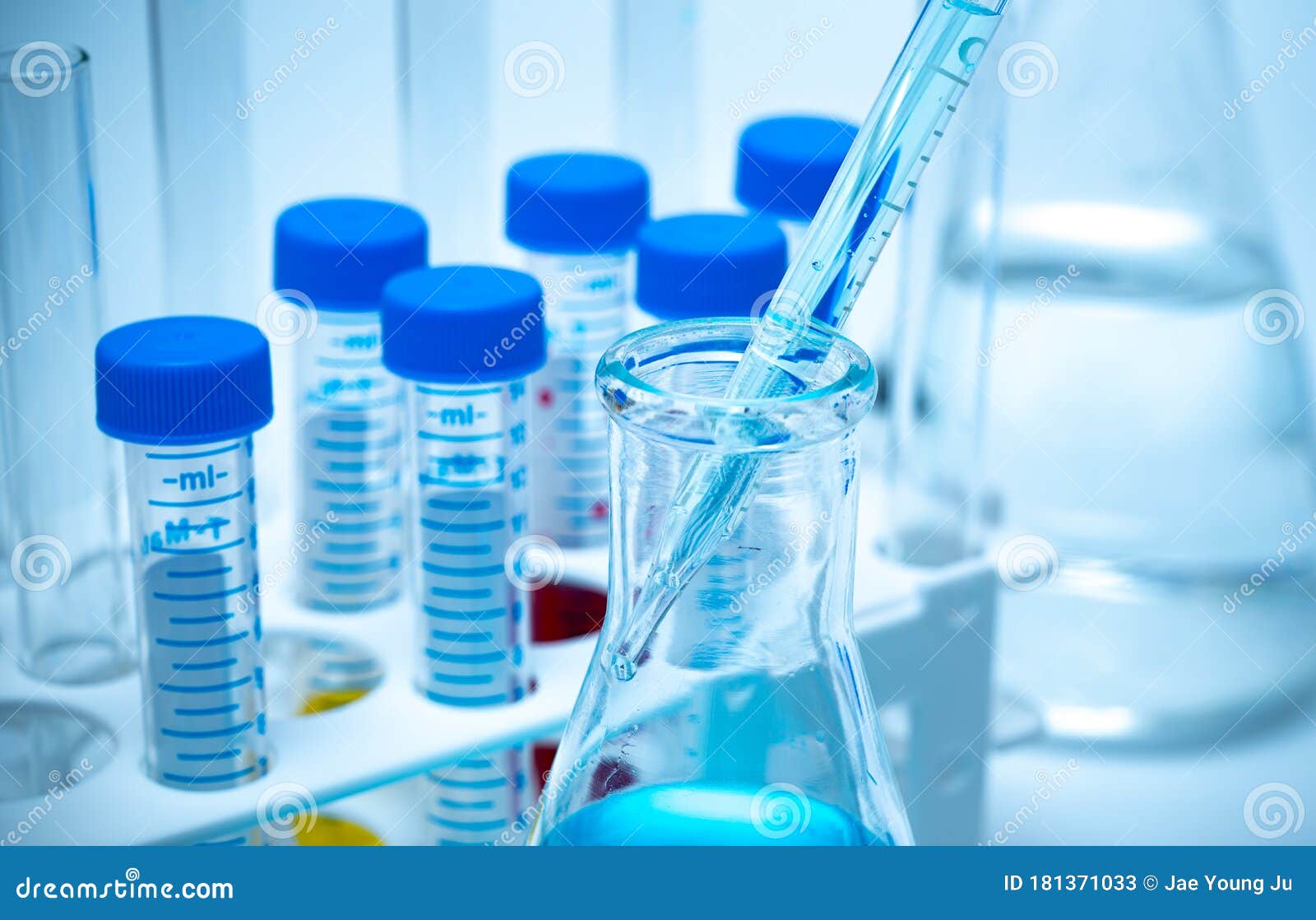 Close-up of the Test Tube on a Blue Background Stock Image - Image of ...