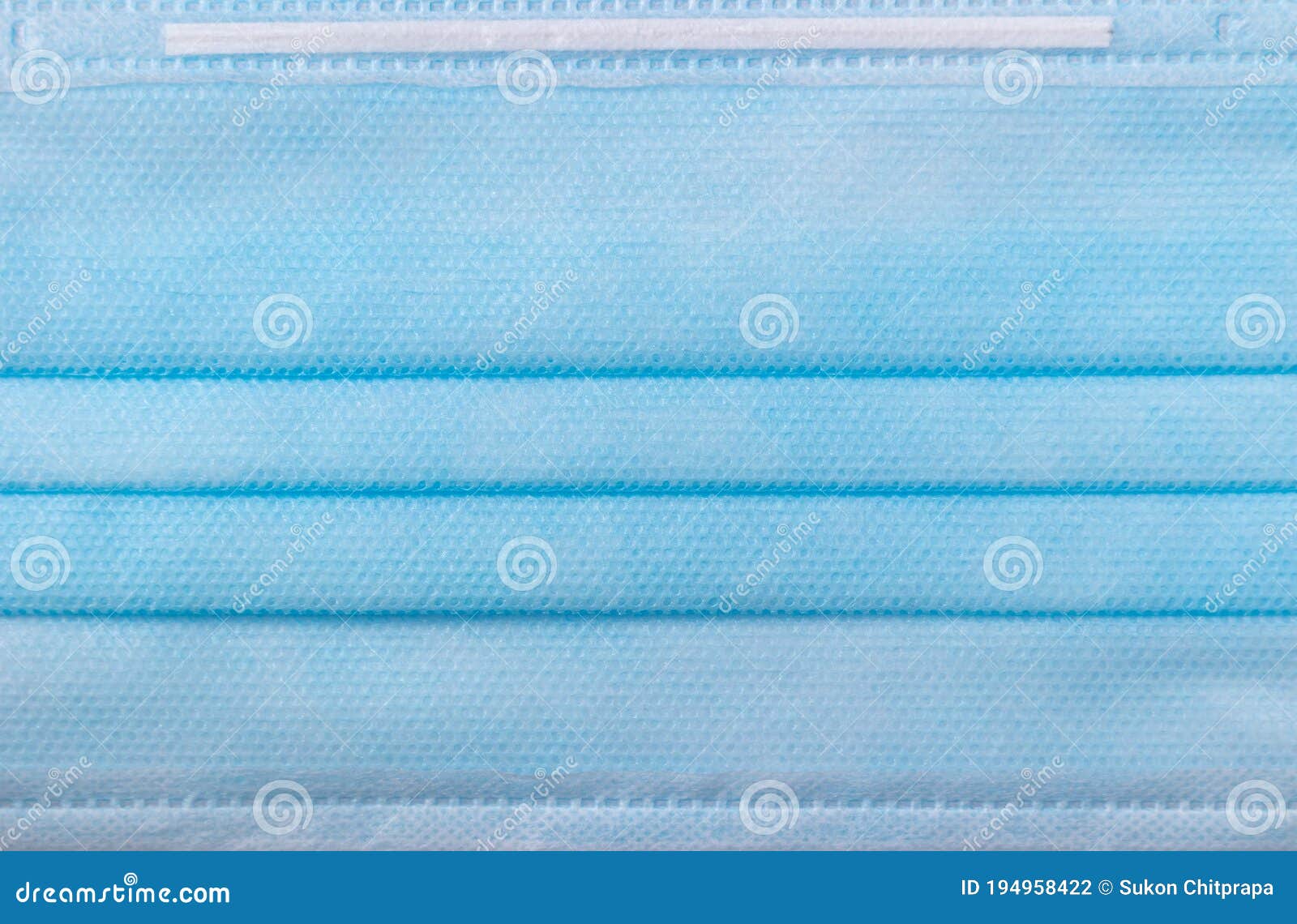 Texture of blue face mask stock photo. Image of detail - 194958422