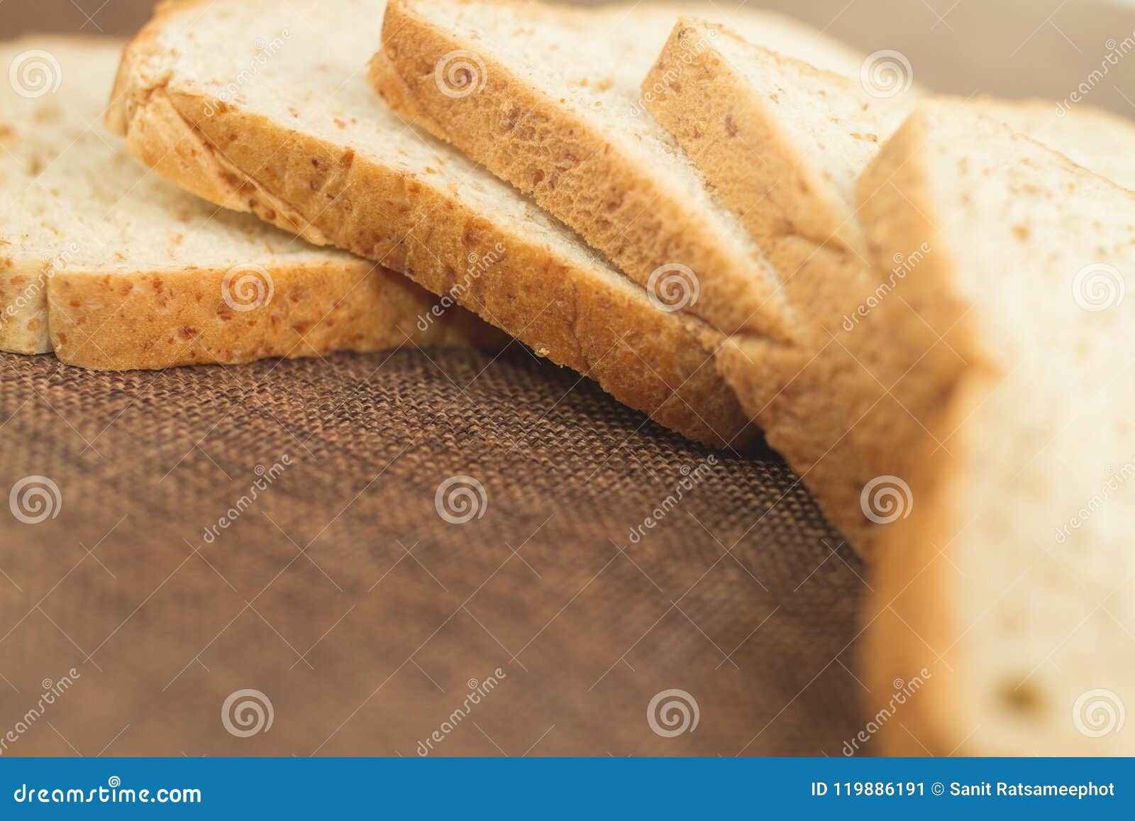 Pile Slice of Whole Wheat Bread on Dark Brown Calico. Stock Image ...