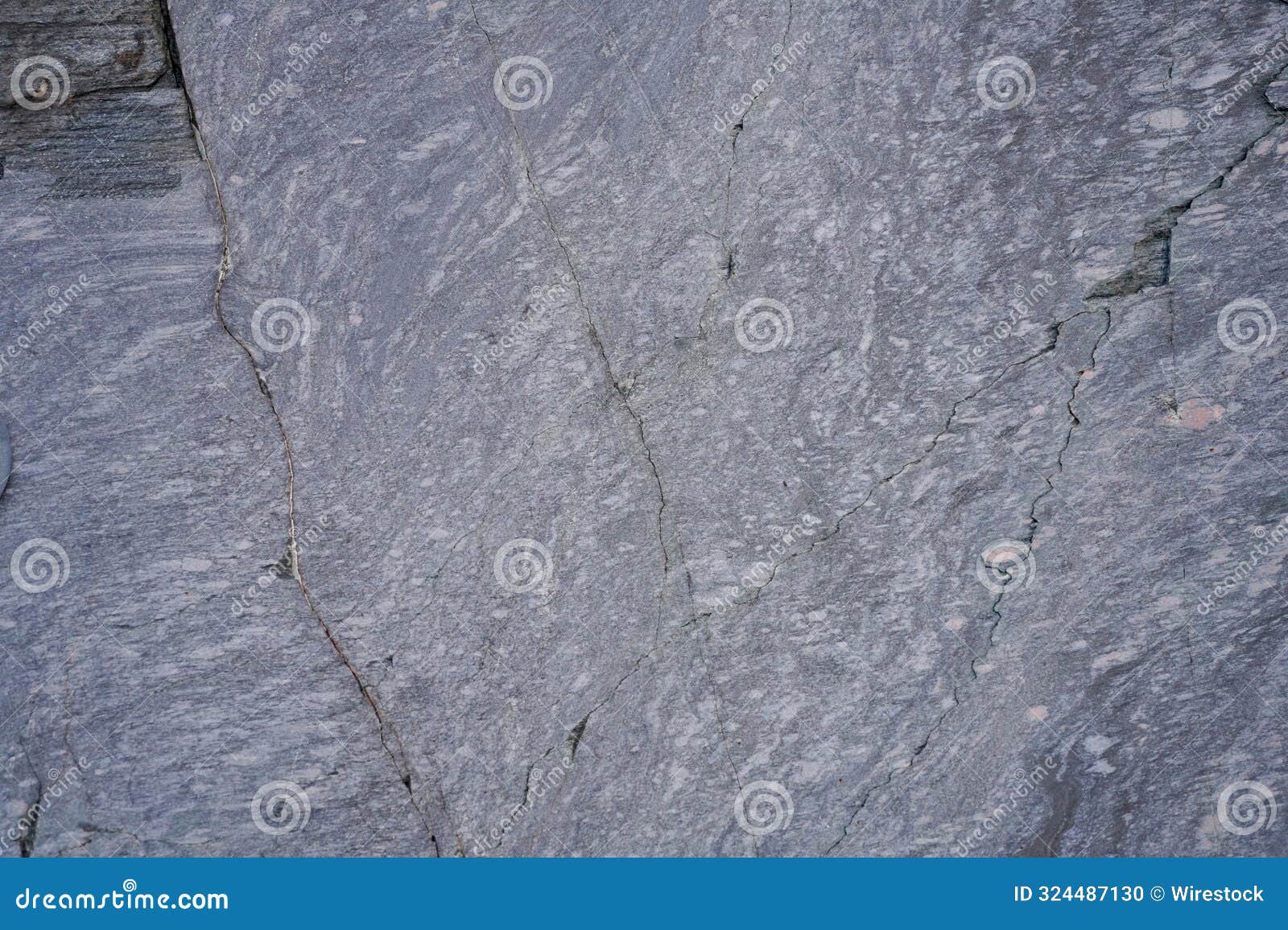 Close-up of a Textured Rock Surface with Visible Cracks and Patterns ...