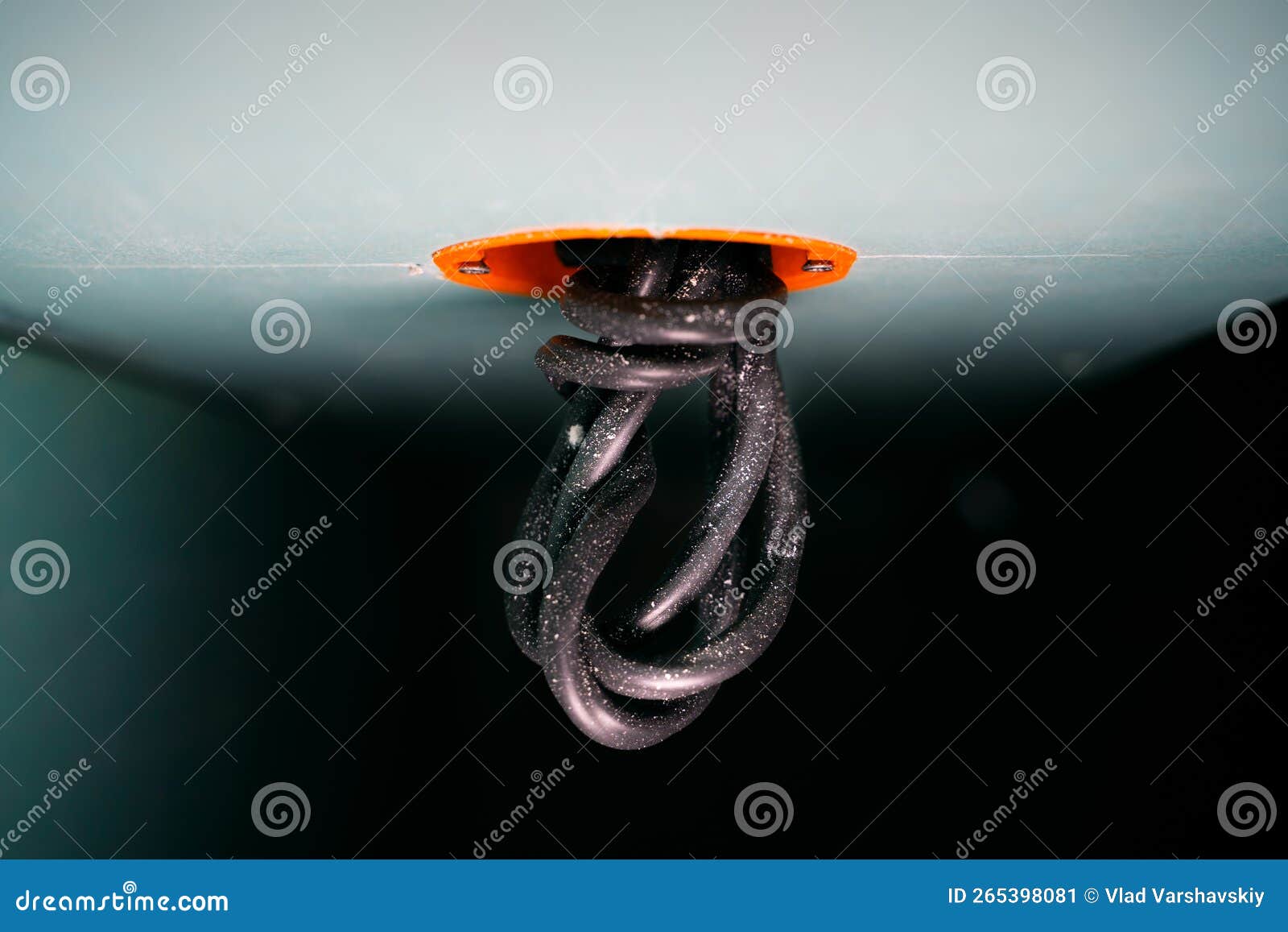 Close-up of a Thick Black Wire Sticking Out of an Orange Round Drywall ...