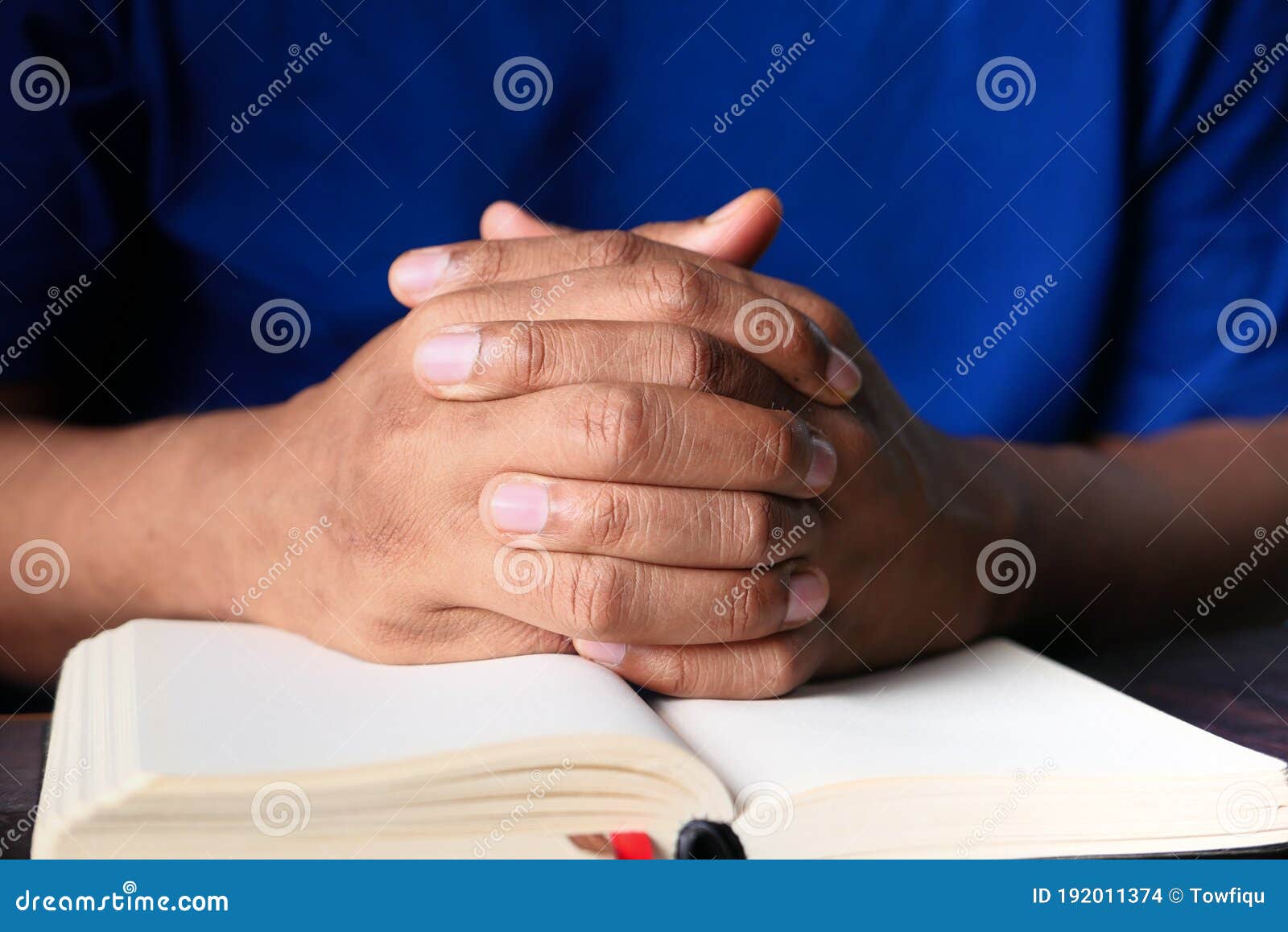 Close Up of Thoughtful Person`s Hand on a Open Book Stock Photo - Image ...
