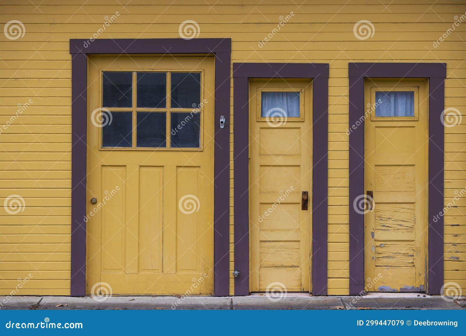 Close Up of Three Doors on the Side of a Building Stock Image - Image ...