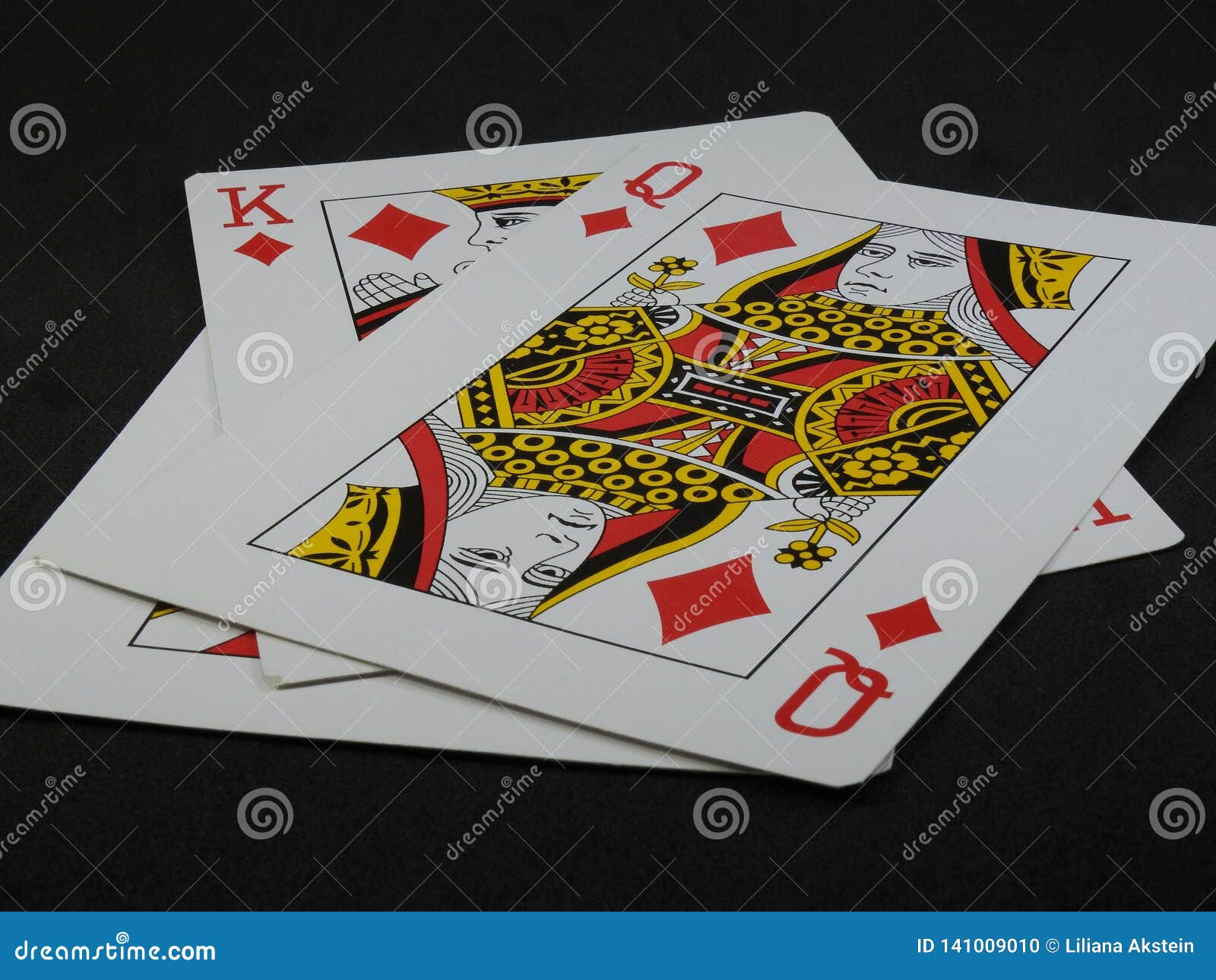 Three Playing Cards. we Can See the King and the Queen of Diamonds ...
