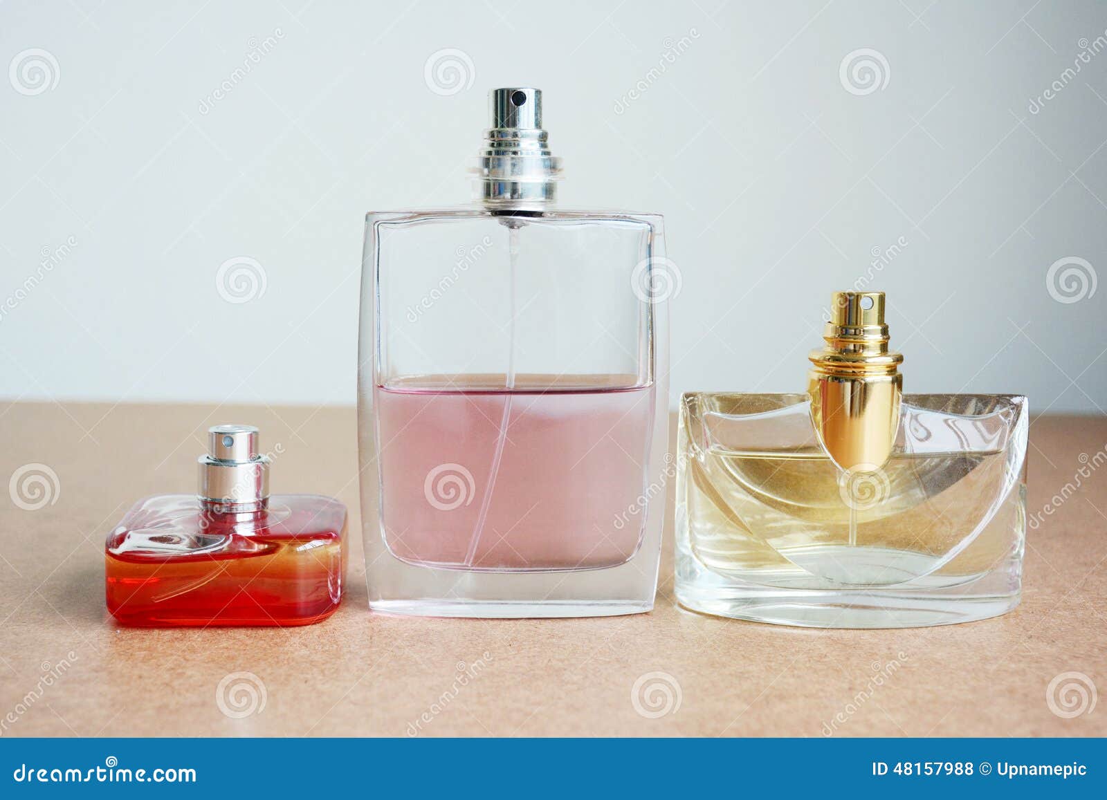 Close Up Three Shapes of Perfume Bottles. Stock Photo - Image of gold ...