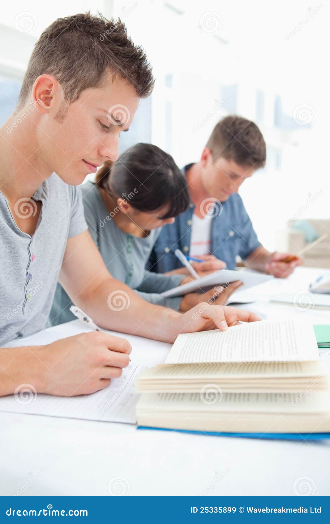 Close Up of Three Students Studying Hard Stock Image - Image of ...