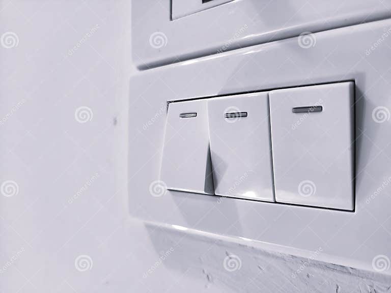 Close-up of Three White Light Switches on a Wall Stock Photo - Image of ...