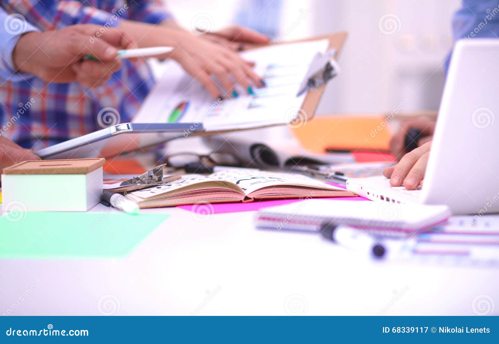Close-up of Three Young Creative Designers Working on Project Together ...