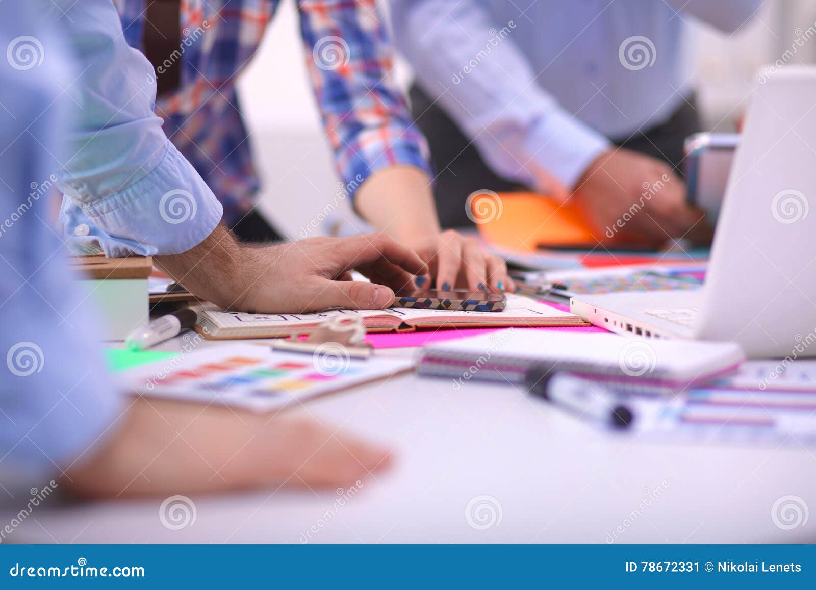 Close-up of Three Young Creative Designers Working on Project Together ...