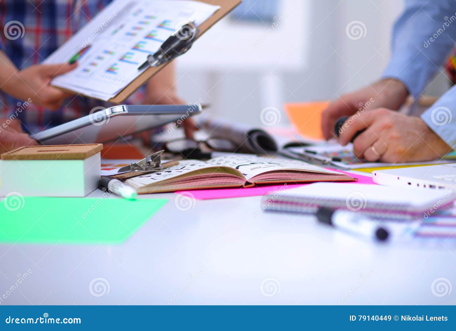 Close-up of Three Young Creative Designers Working on Project Together ...