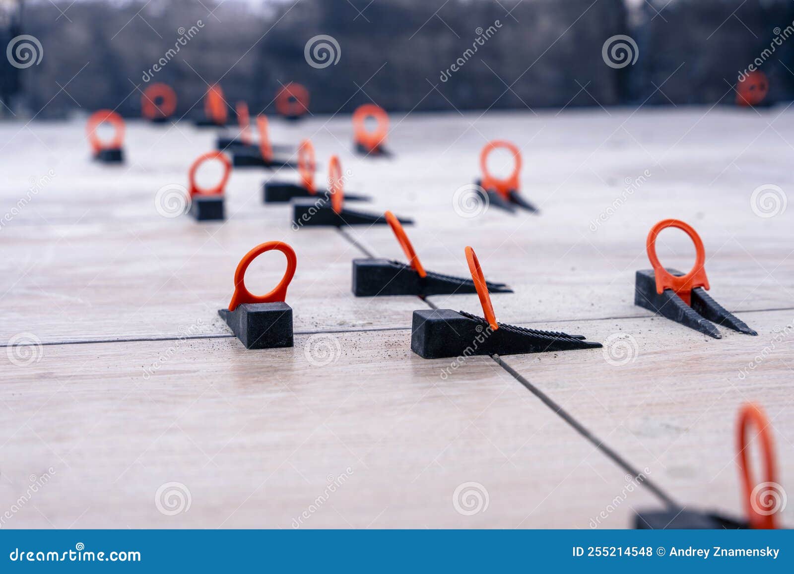 Close-up of the Tile Alignment System Holding Tile in Given Position ...