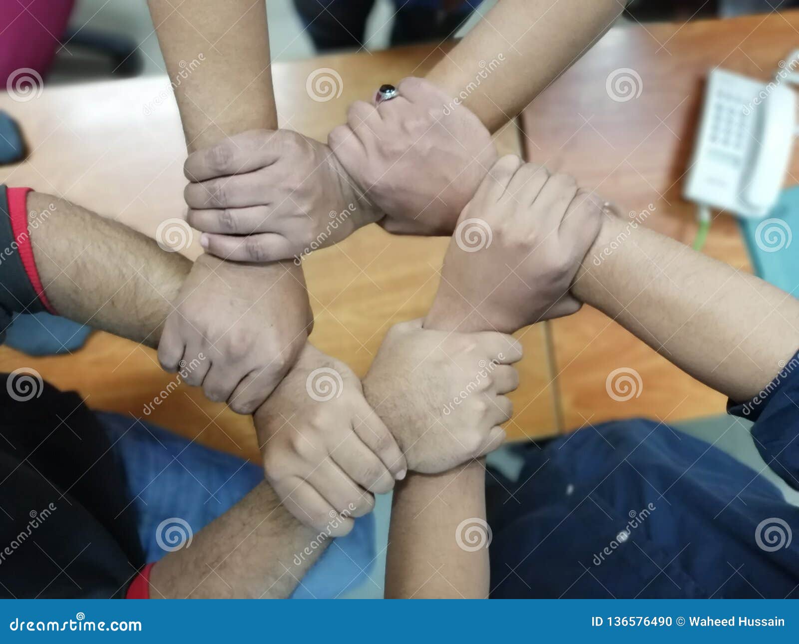 Close Up Top View of Young People Joining Their Hands Together Joining ...