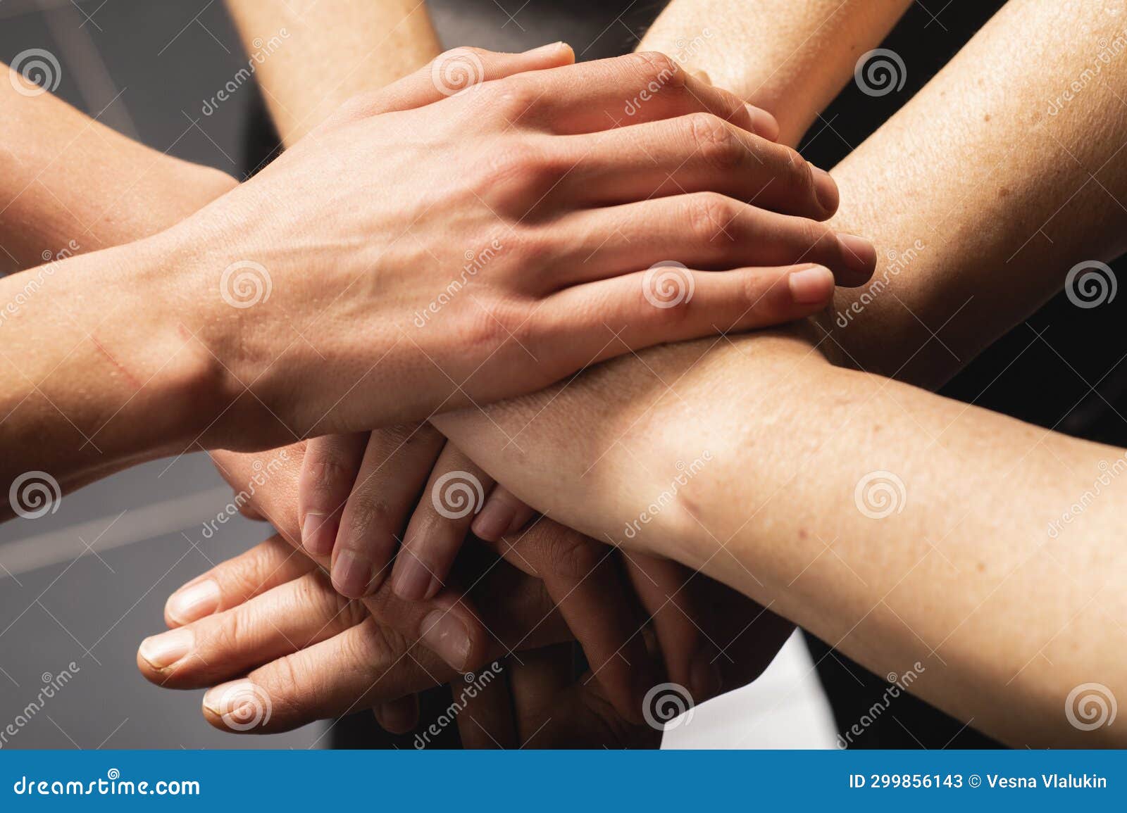 Friends with Stack of Hands Showing Unity and Teamwork Stock Image ...