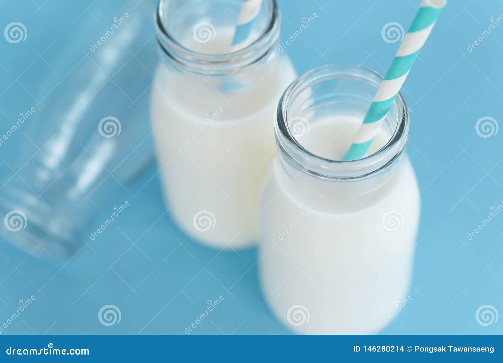 Close Up Topview Bottle of Fresh Milk with Straw on Light Blue ...
