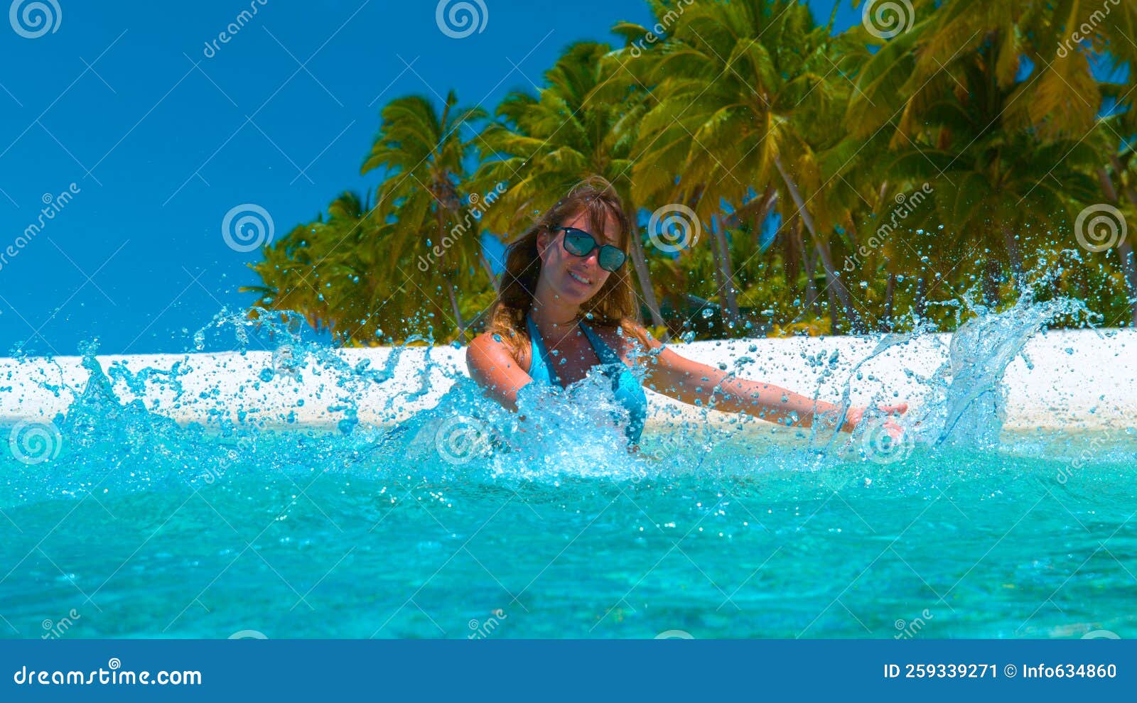 Close Up Tourist Girl Spraying Sea Water With Her Hands By Beautiful Shore Stock Image Image