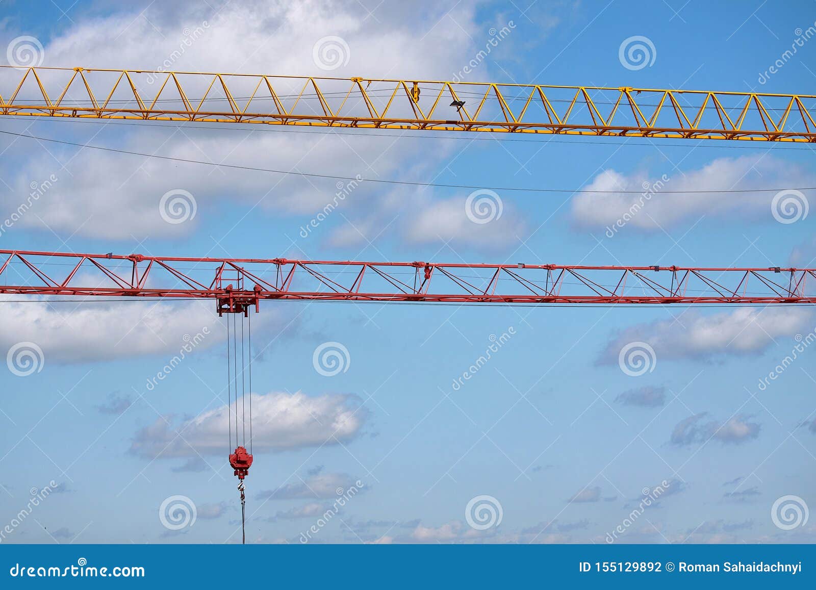 Close-up of Two Arrows of Construction Cranes Arranged in Parallel ...
