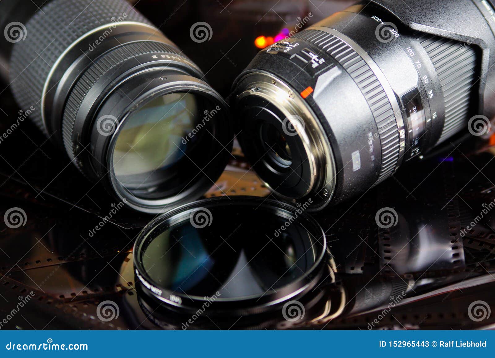 Close Up of Two Camera Lenses with Isolated Circular Filter on Negative ...