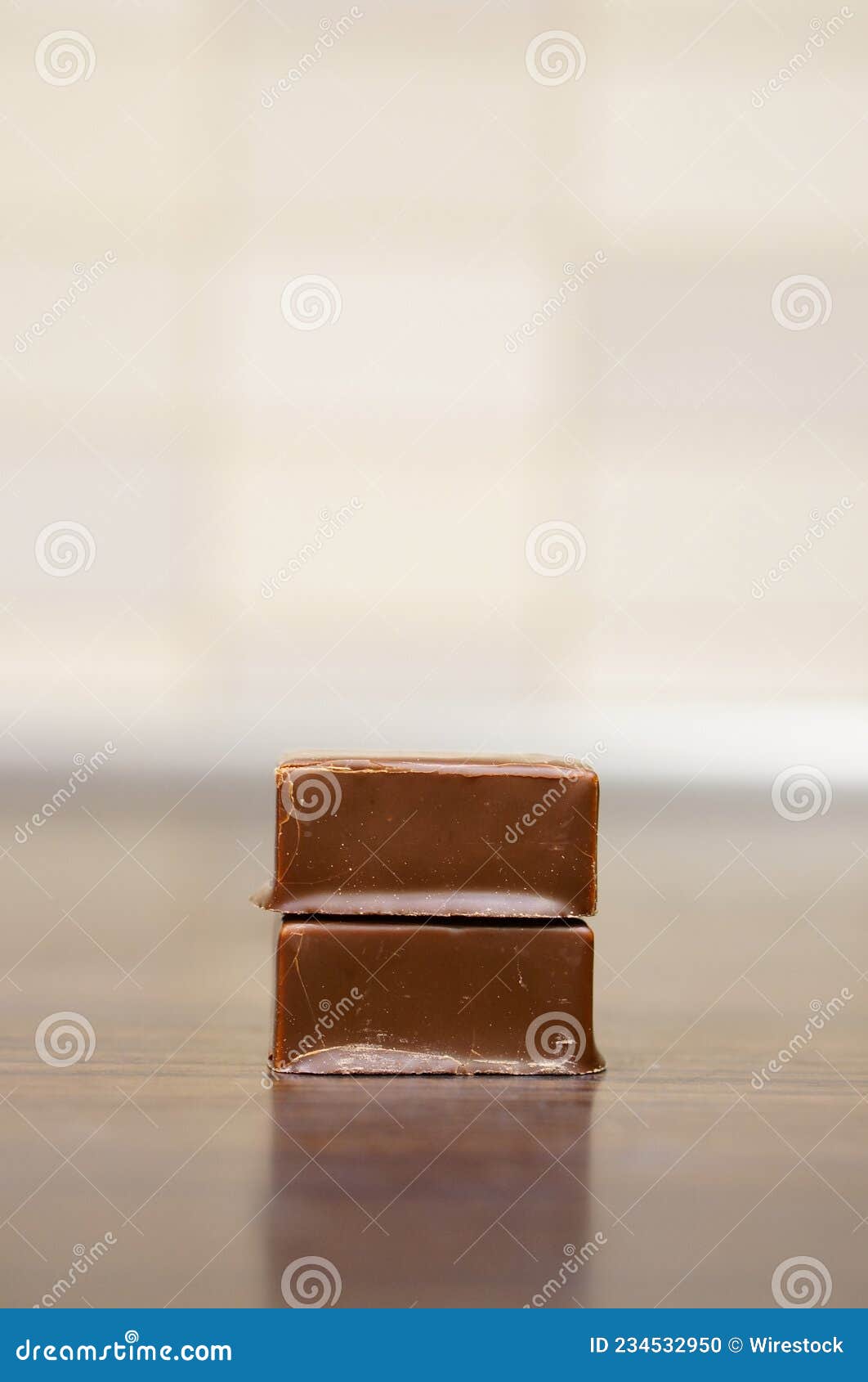 Close Up of Two Cubes of Chocolate on a Row on a Reflecting Table Stock ...