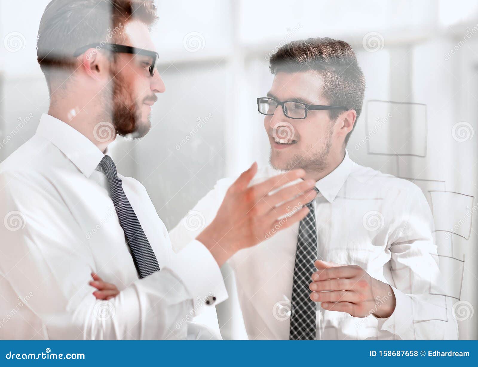 Close Up.two Employees Talking Standing in the Office Stock Photo ...