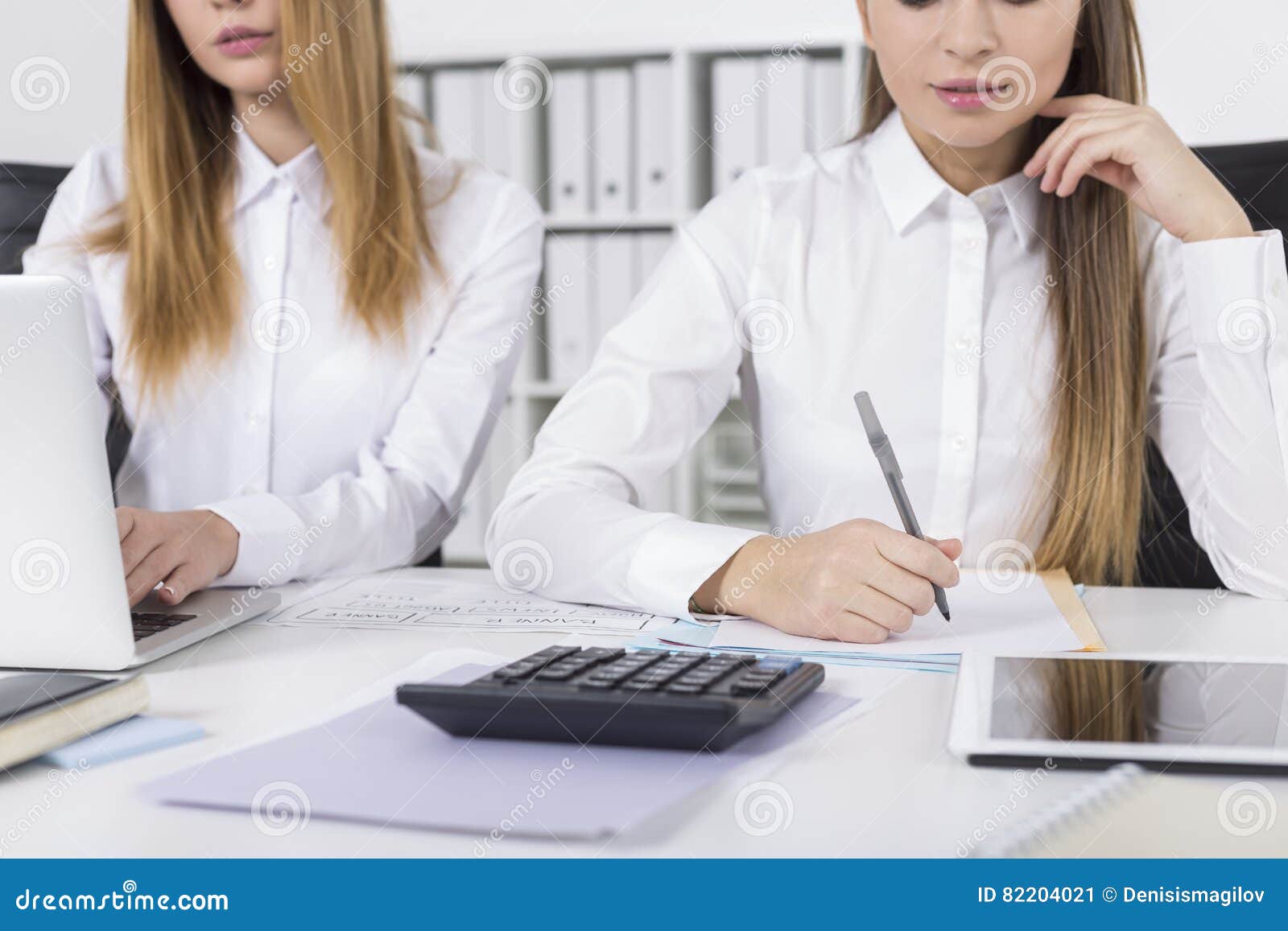 Close Up of Two Girls Working in an Office Stock Image - Image of ...