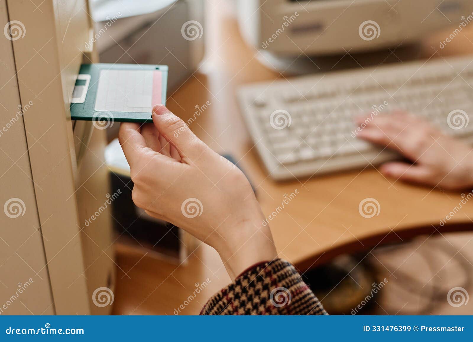 Inserting Floppy Disk into Drive in Office Setting Stock Image - Image ...